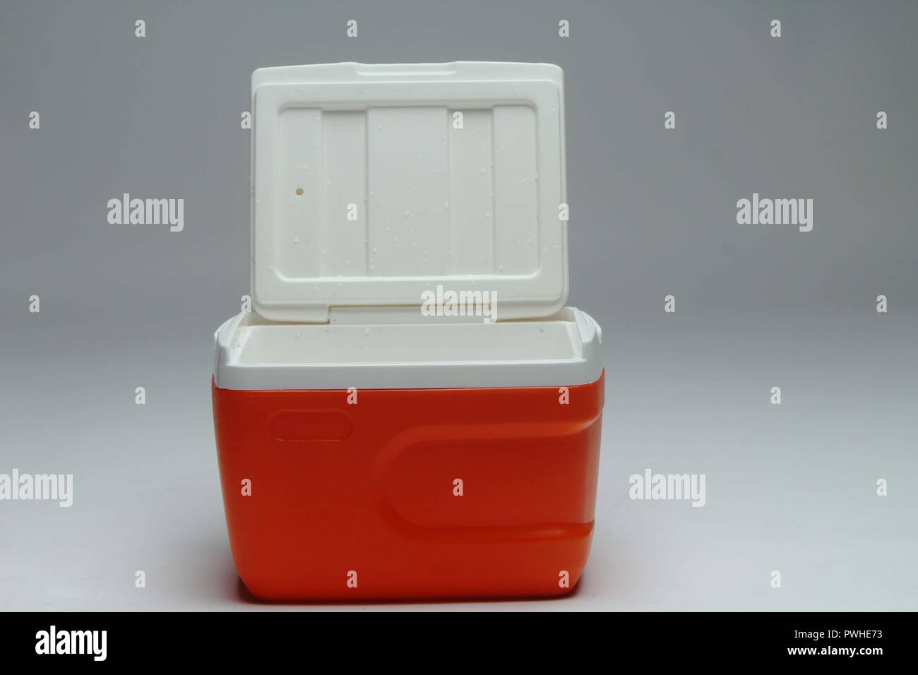 close up of opened handheld red refrigerator. Isolated on white ...