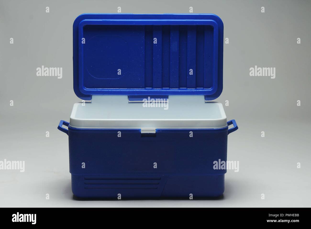 Opened Handheld blue refrigerator, ice box. Isolated on white ...