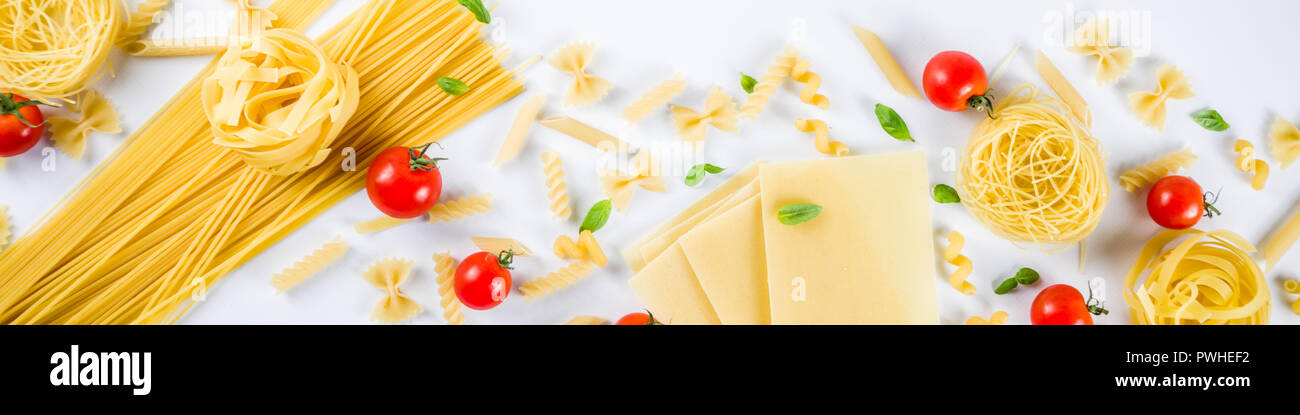 Italian food concept, various raw pasta assortment - spaghetti, lasagna ...