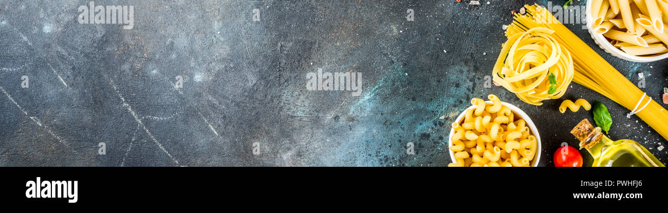 Italian food concept, various raw pasta assortment - spaghetti, lasagna ...