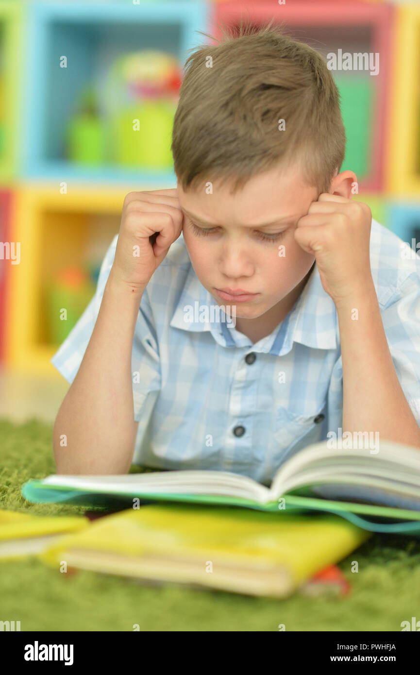 Portrait of a young boy doing homework Stock Photo - Alamy