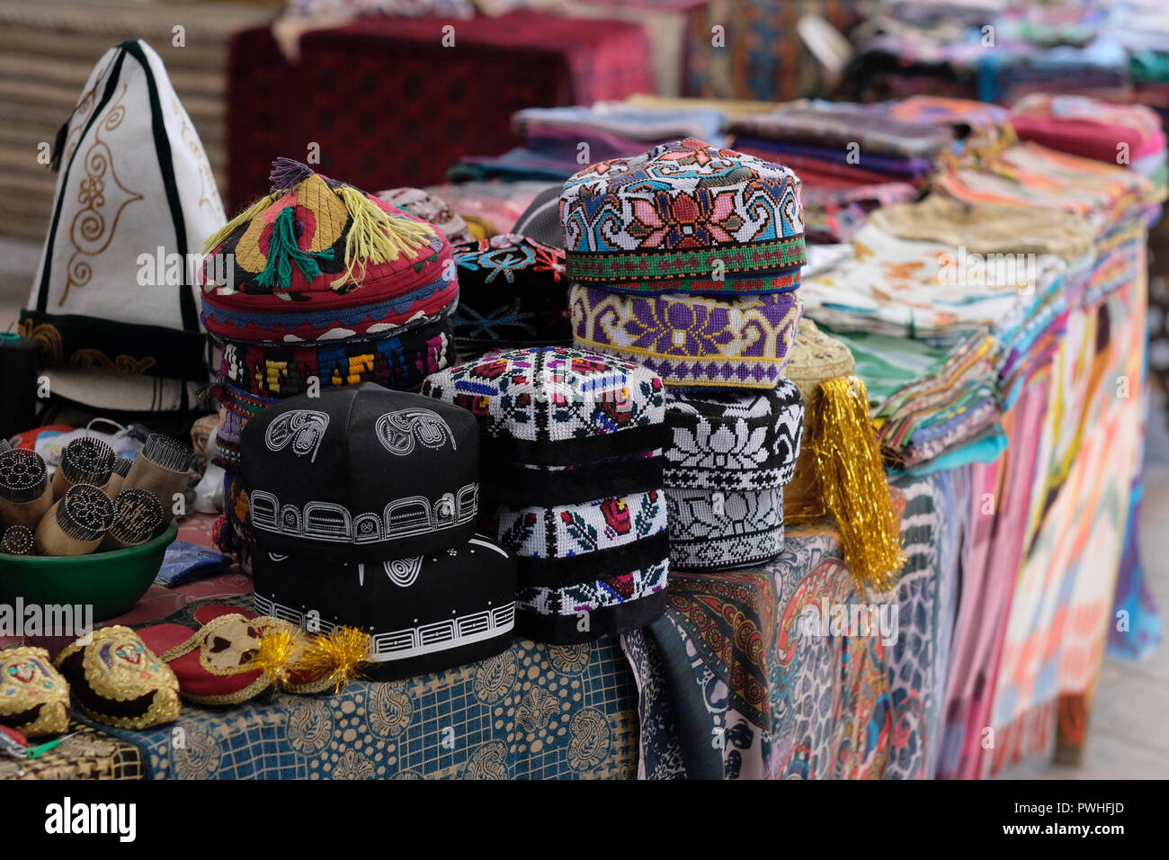 Stack of Tubeteika or Tubatay traditional richly embroidered caps worn ...