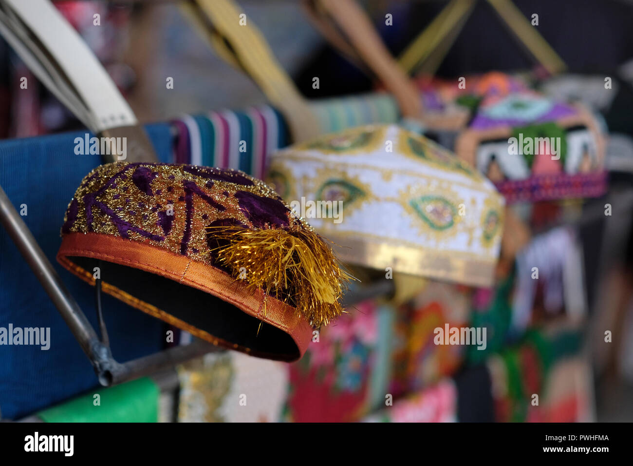 Stack of Tubeteika or Tubatay traditional richly embroidered caps worn ...
