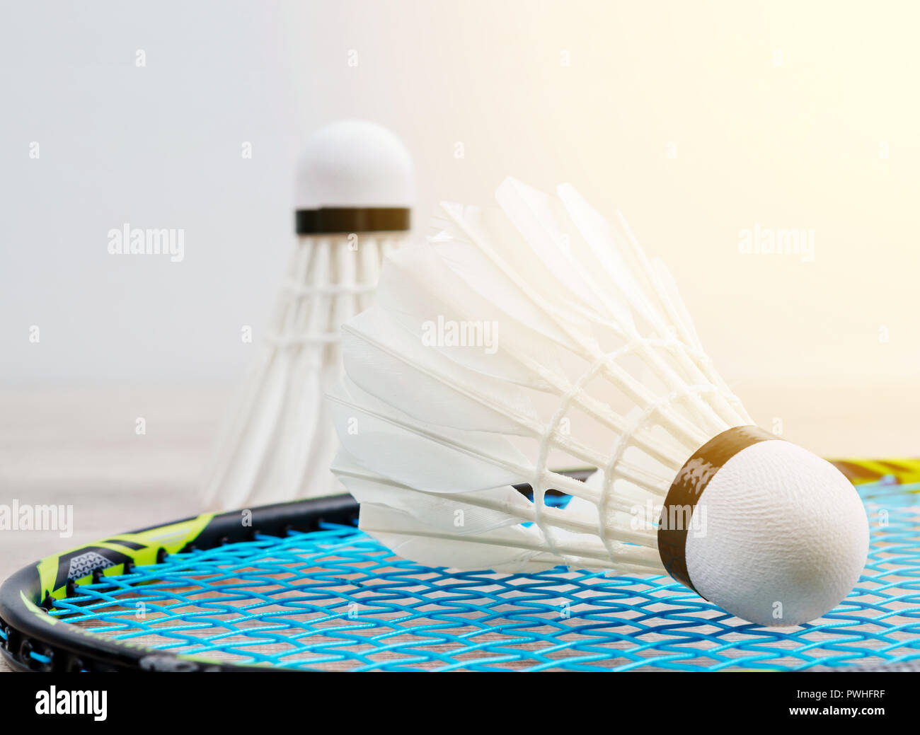 Close up shuttlecock and badminton racket on wooden background Stock ...