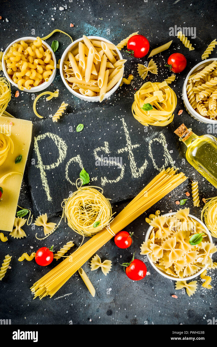 Italian food concept, various raw pasta assortment - spaghetti, lasagna ...