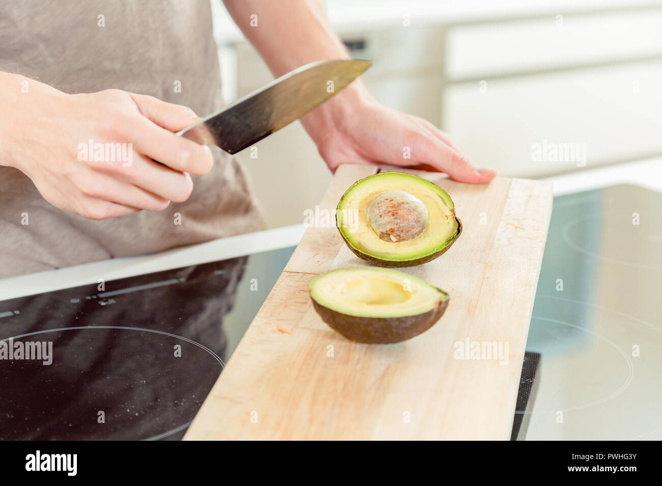 A man cutting avocado Stock Photo - Alamy