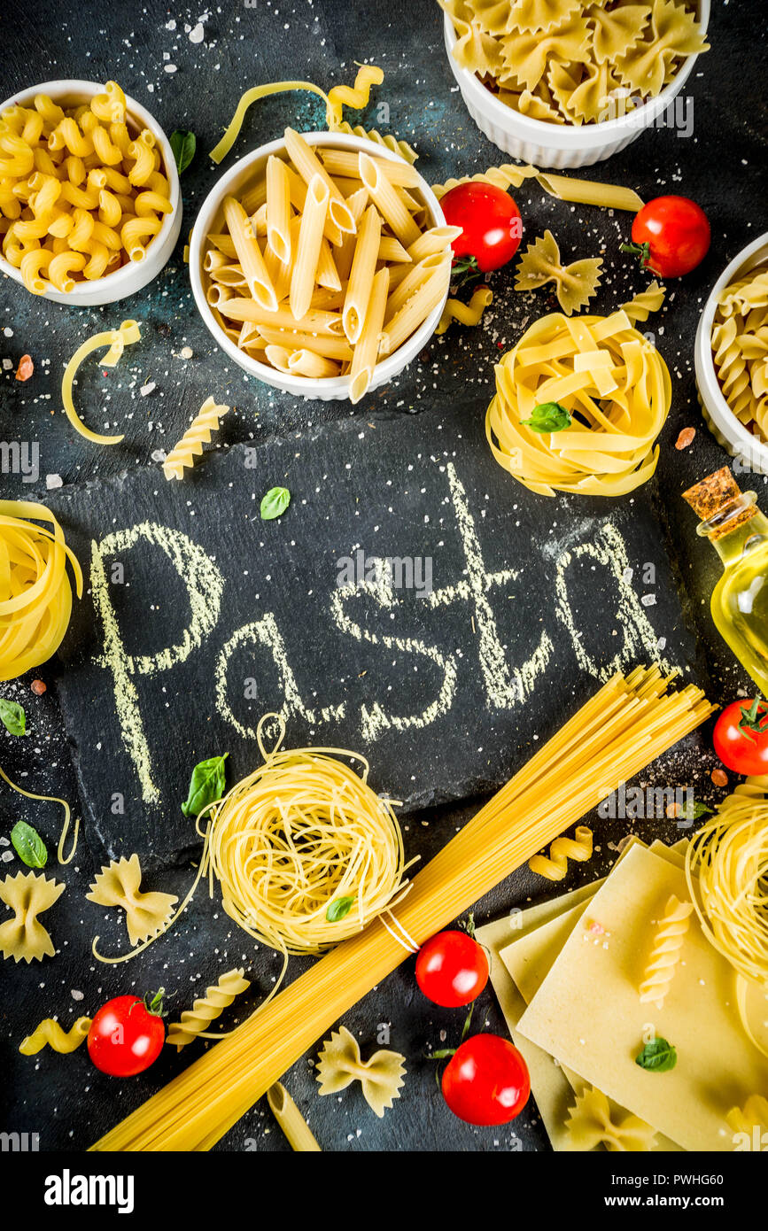 Italian food concept, various raw pasta assortment - spaghetti, lasagna ...