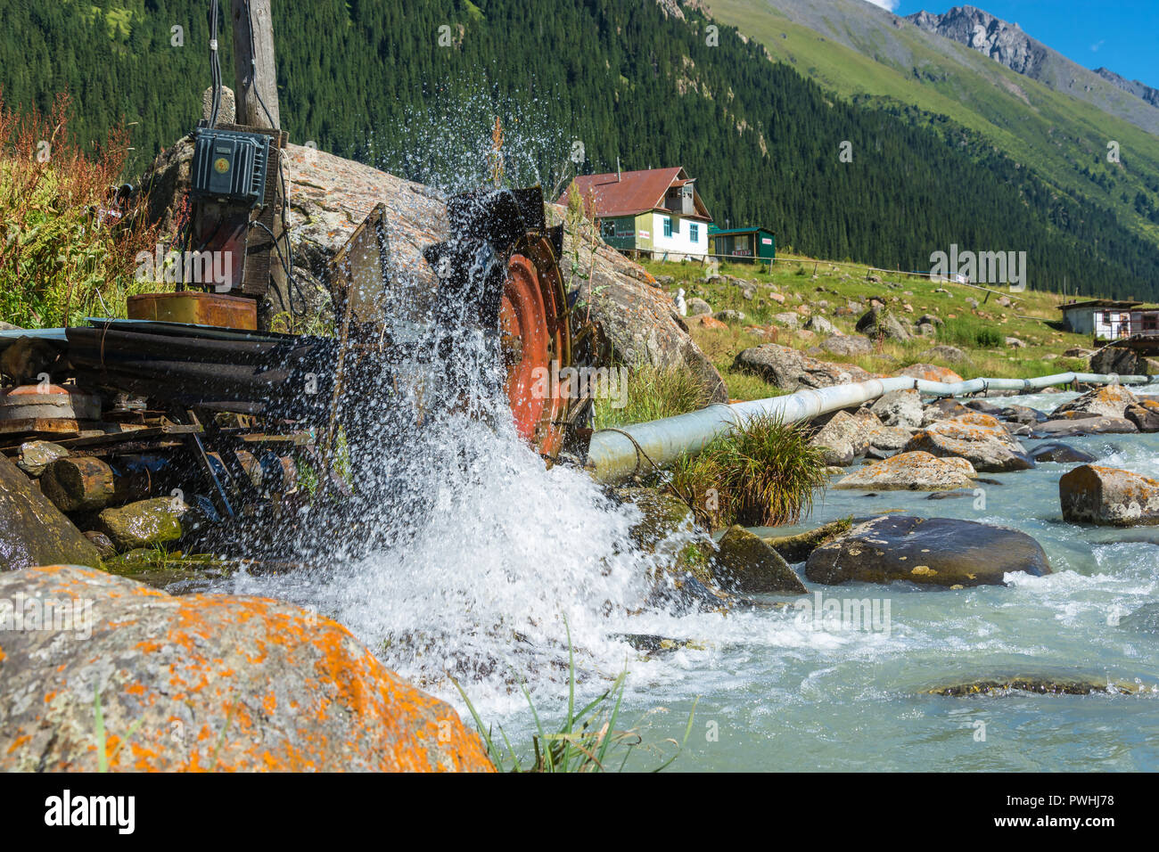 A small hydroelectric dam on a wild river Arashan, Kyrgyzstan Stock ...