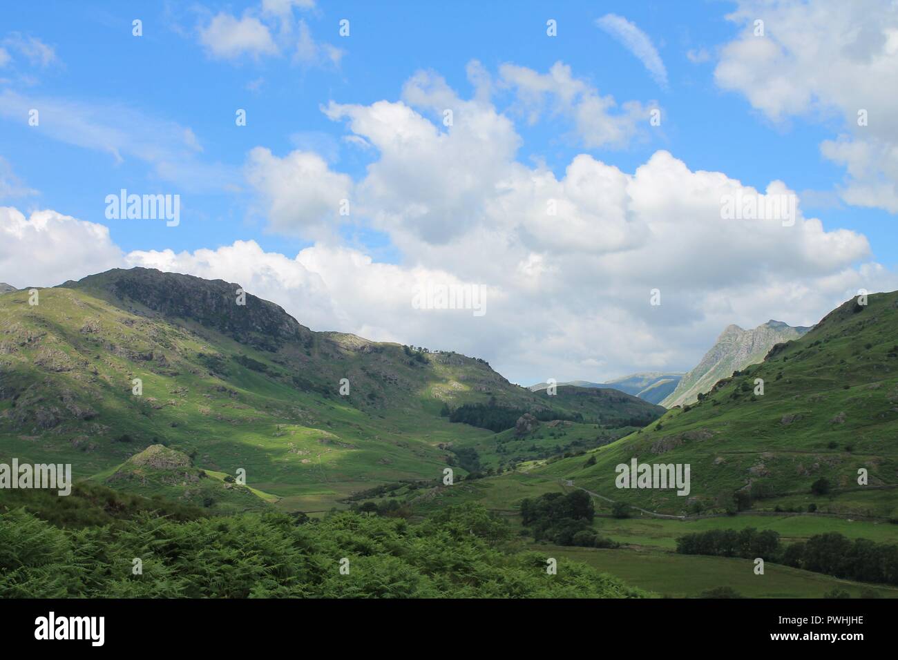 UK Little Langdale. View towards the distant Langdale Pikes viewed from ...