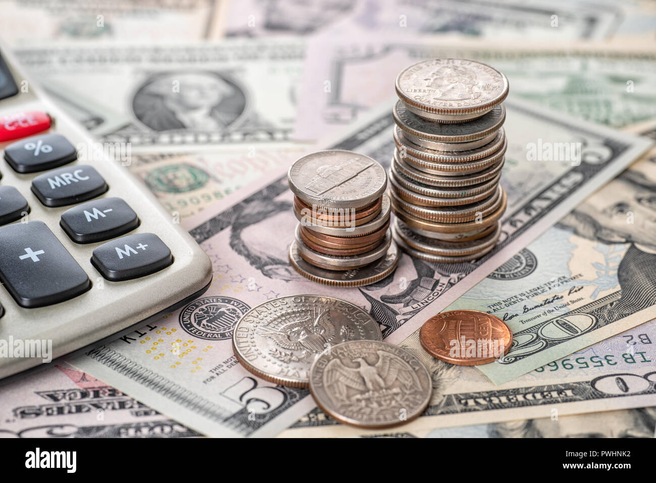 Coins stack calculator dollar hi-res stock photography and images - Alamy