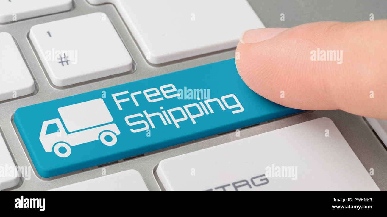 A keyboard with a blue labeled button - Free Shipping Stock Photo - Alamy