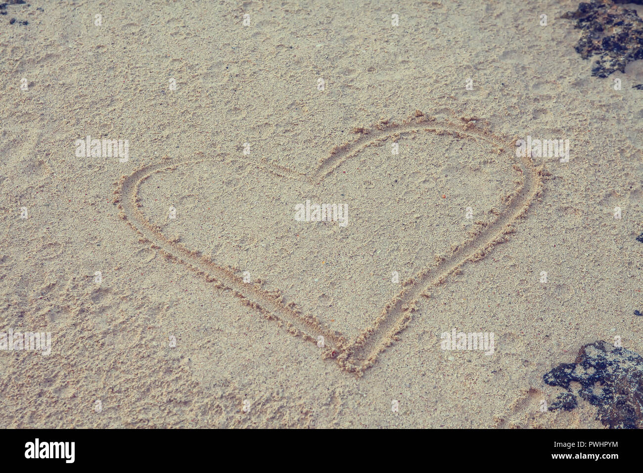 Heart drawn in sand Stock Photo - Alamy