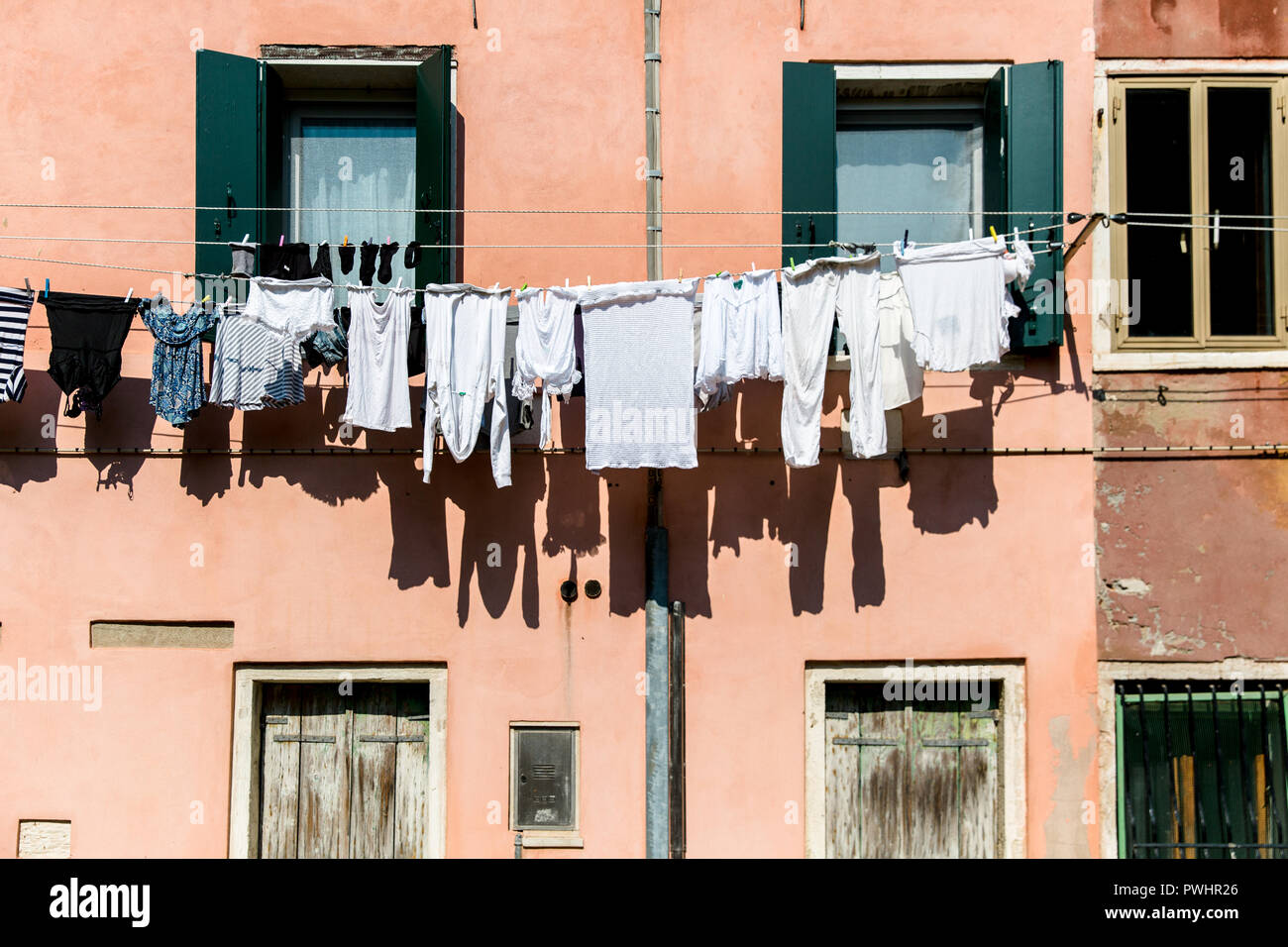 Washing lines in front of traditional buildings by the canals on ...