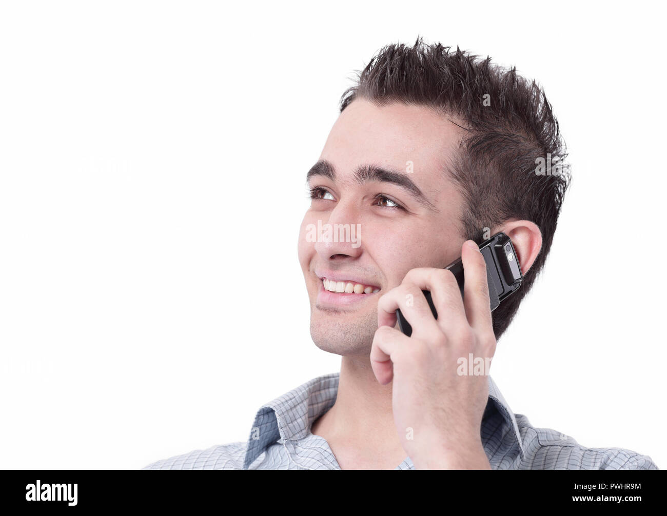 modern young talking on a cell phone.isolated on white. photo with copy ...