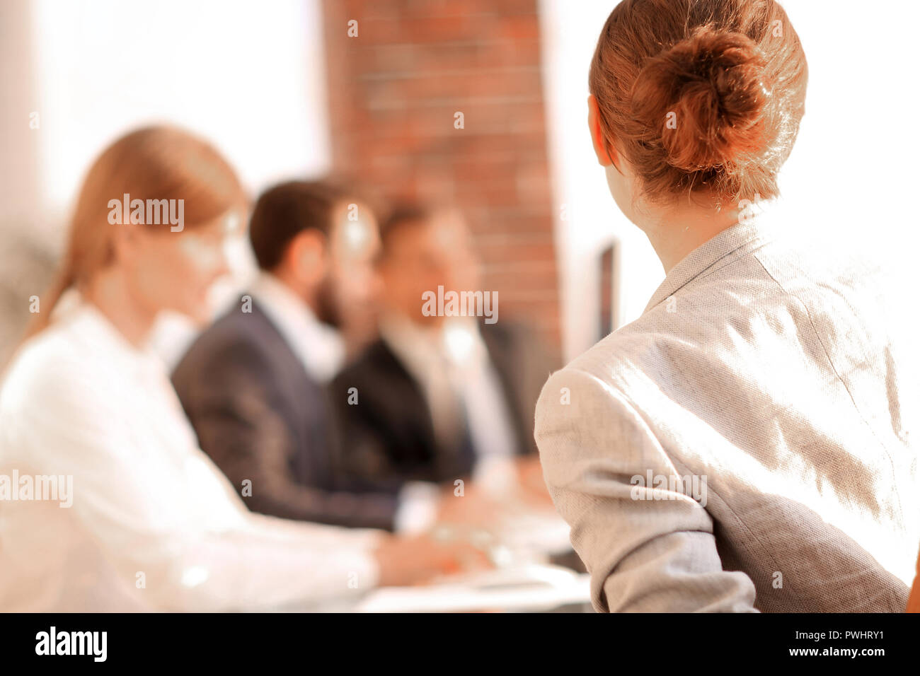 business background. rear view of business woman on blurred background ...