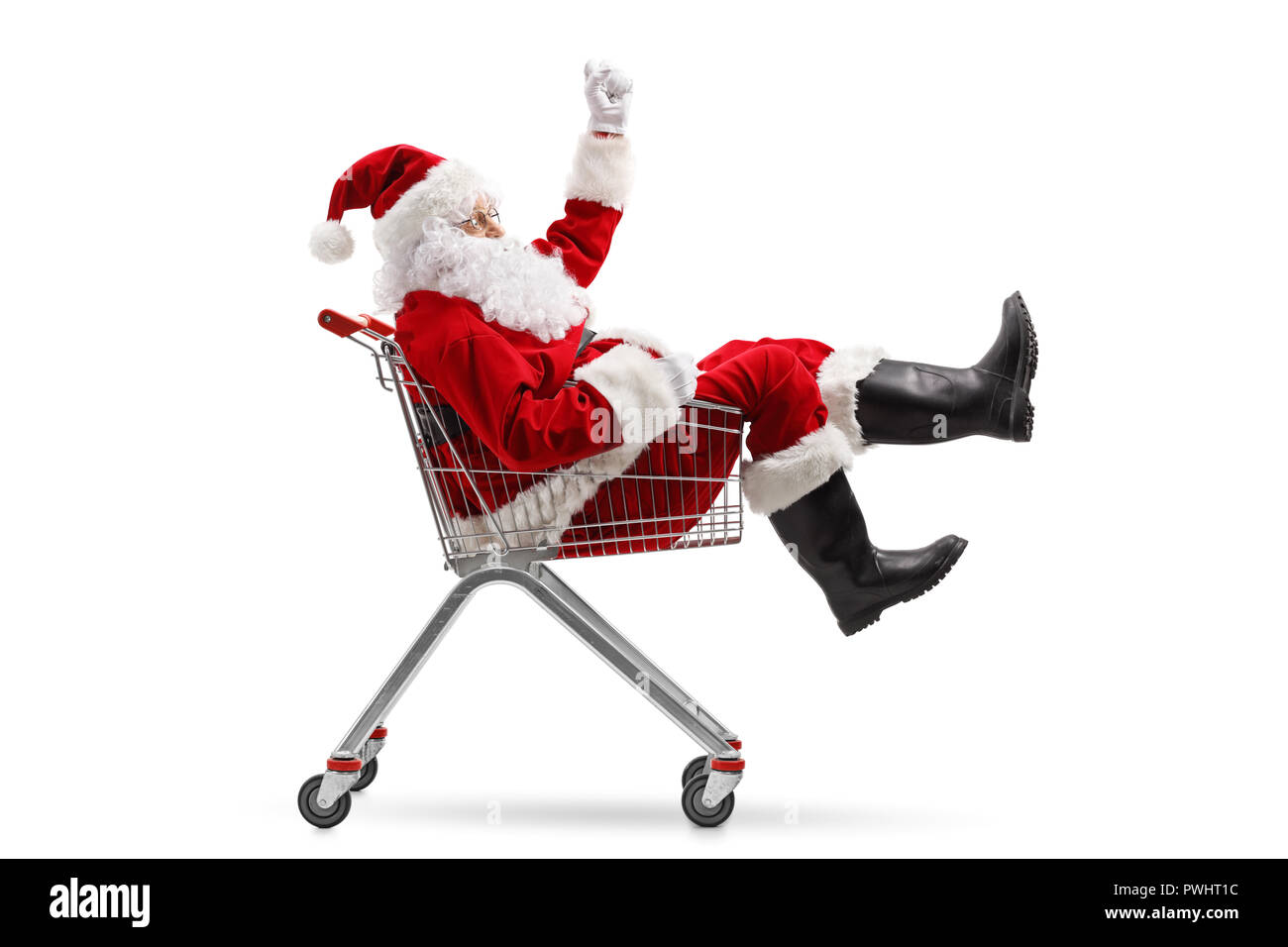 Santa Claus sitting inside a shopping cart isolated on white background ...