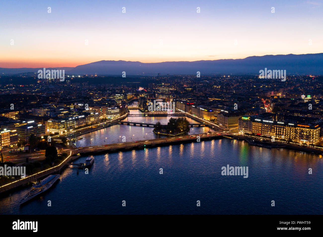 Aerial night view of Geneva city waterfront skyline in Switzerland ...