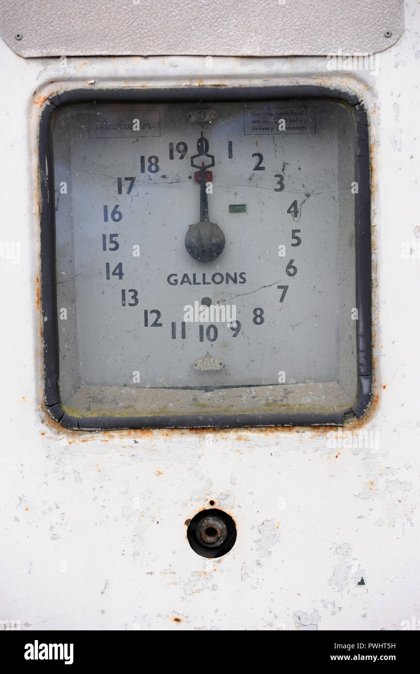 The gallon fuel gauge of an old petrol pump in an abandoned garage ...