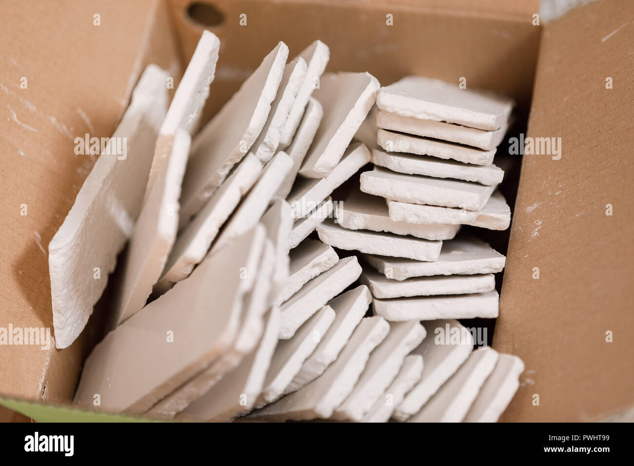 lot of white decorative bricks in box Stock Photo - Alamy