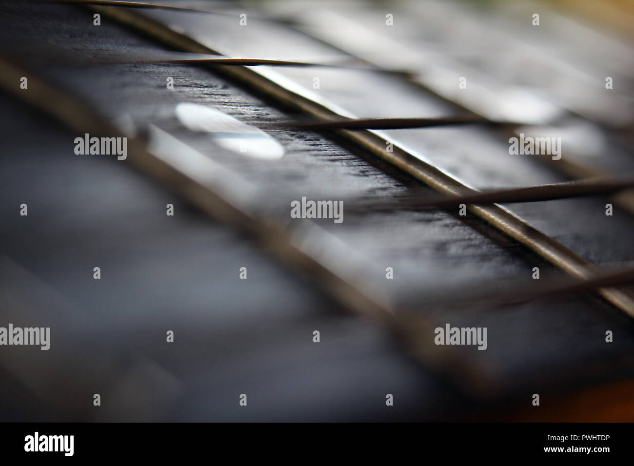 Electric guitar fretboard with steel strings, close-up Stock Photo - Alamy