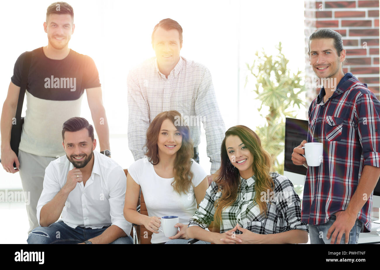 group portrait of successful employees design Agency Stock Photo - Alamy