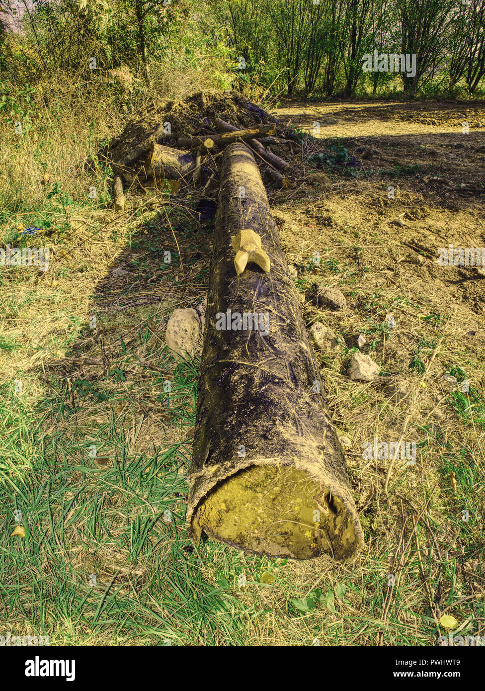 Rusty water pipeline in the trench ground overhead view. Repairing of ...