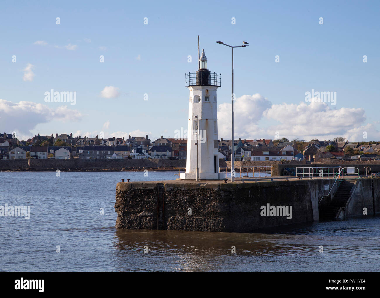 The pier and lighthouse at Anstruther, a fishing village on the ...