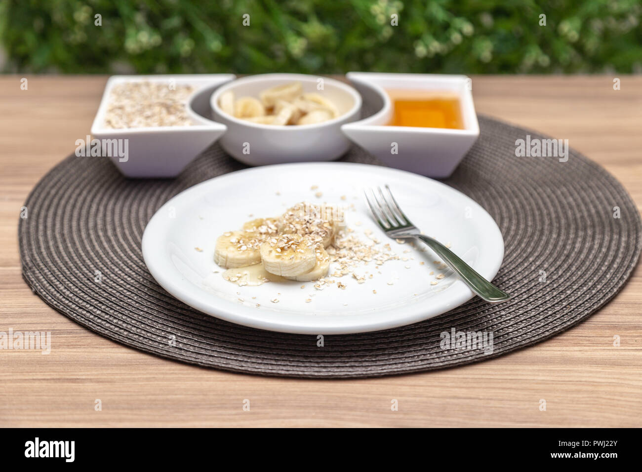 babana with honey and oats. Nutritious and healthy food Stock Photo - Alamy