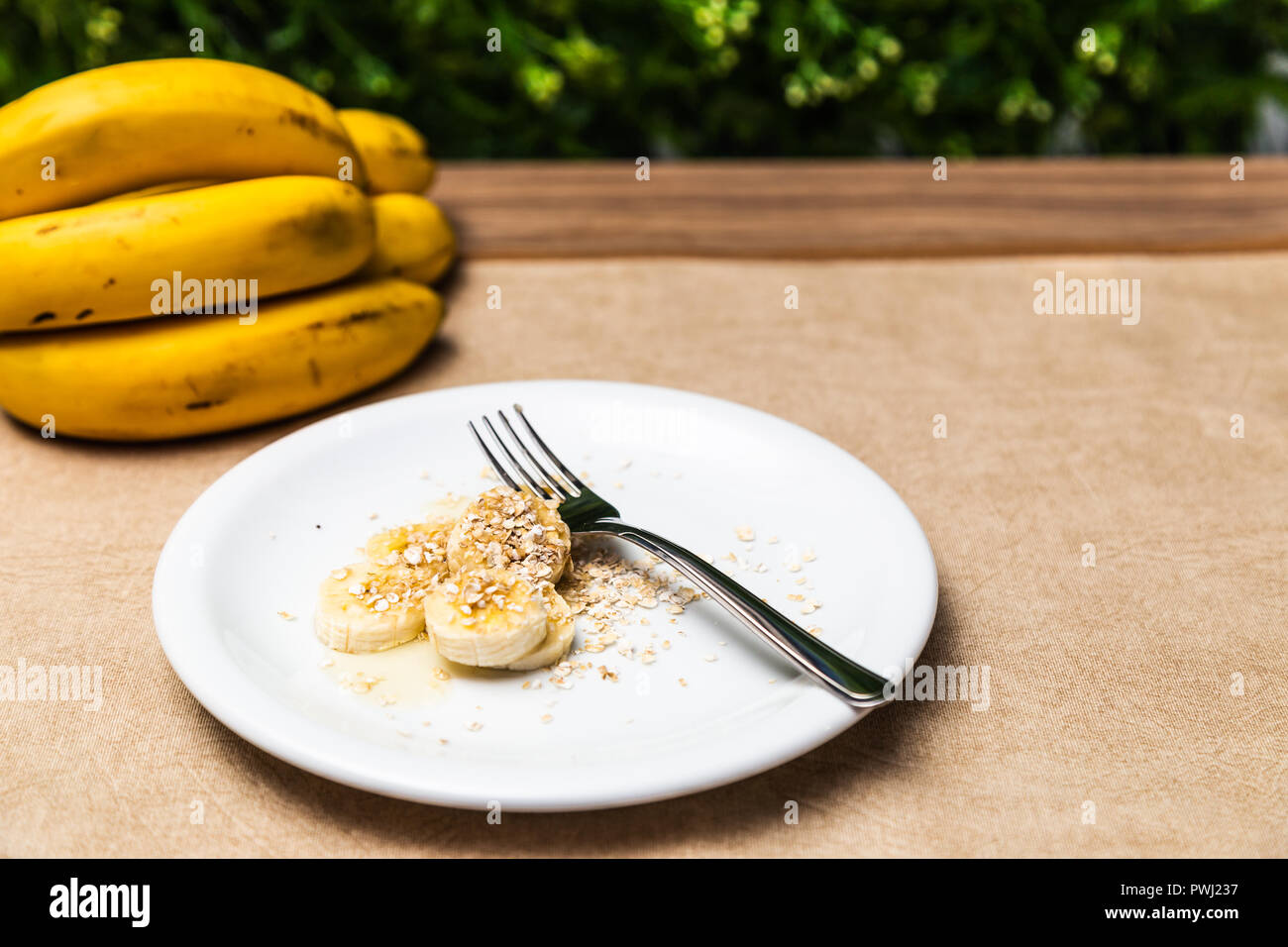 babana with honey and oats. Nutritious and healthy food Stock Photo - Alamy