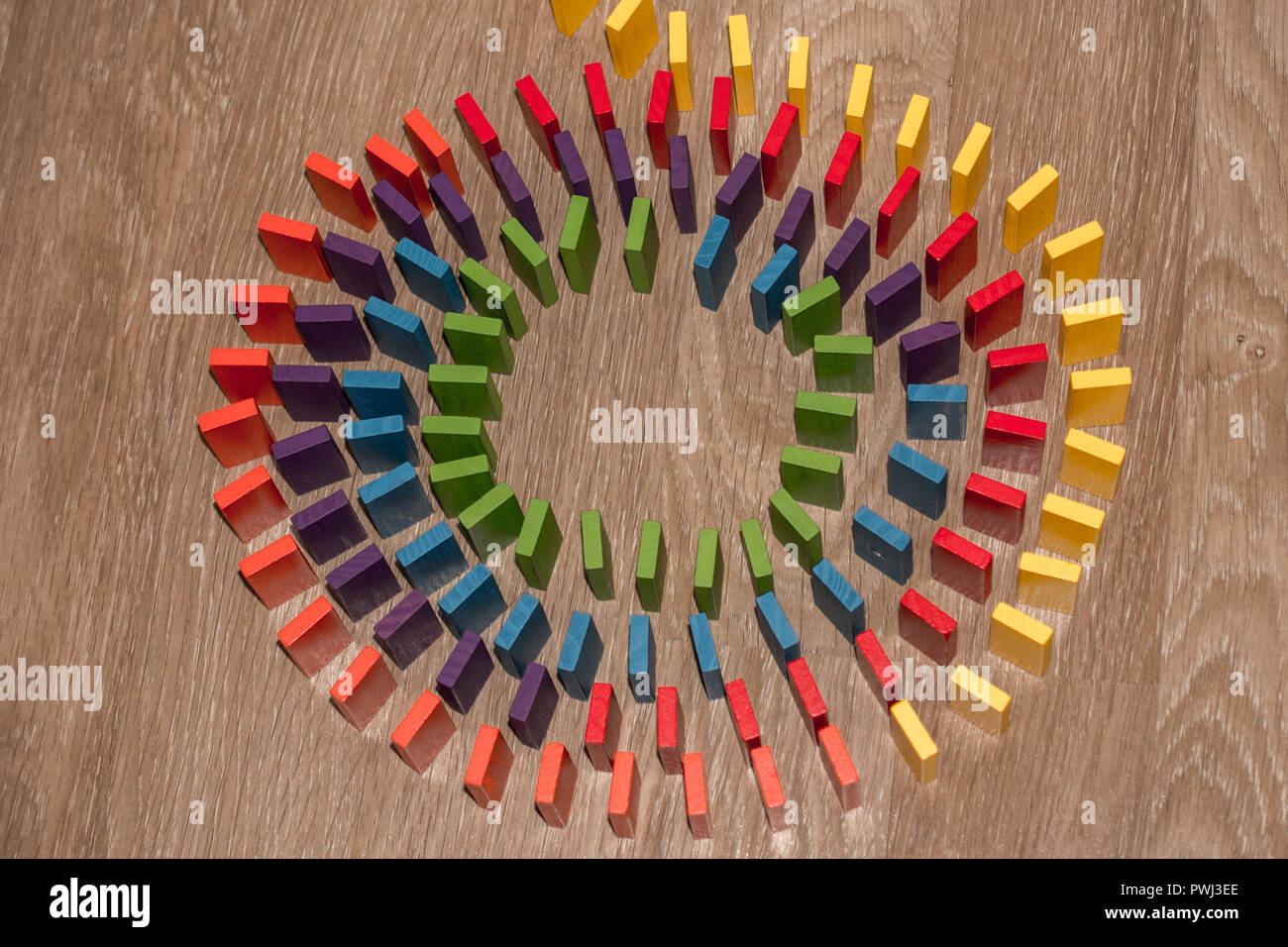 Colorful Domino Blocks in a line on a white background Stock Photo - Alamy