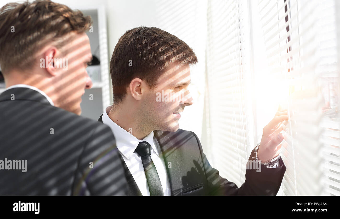 business people look in the window office Stock Photo - Alamy