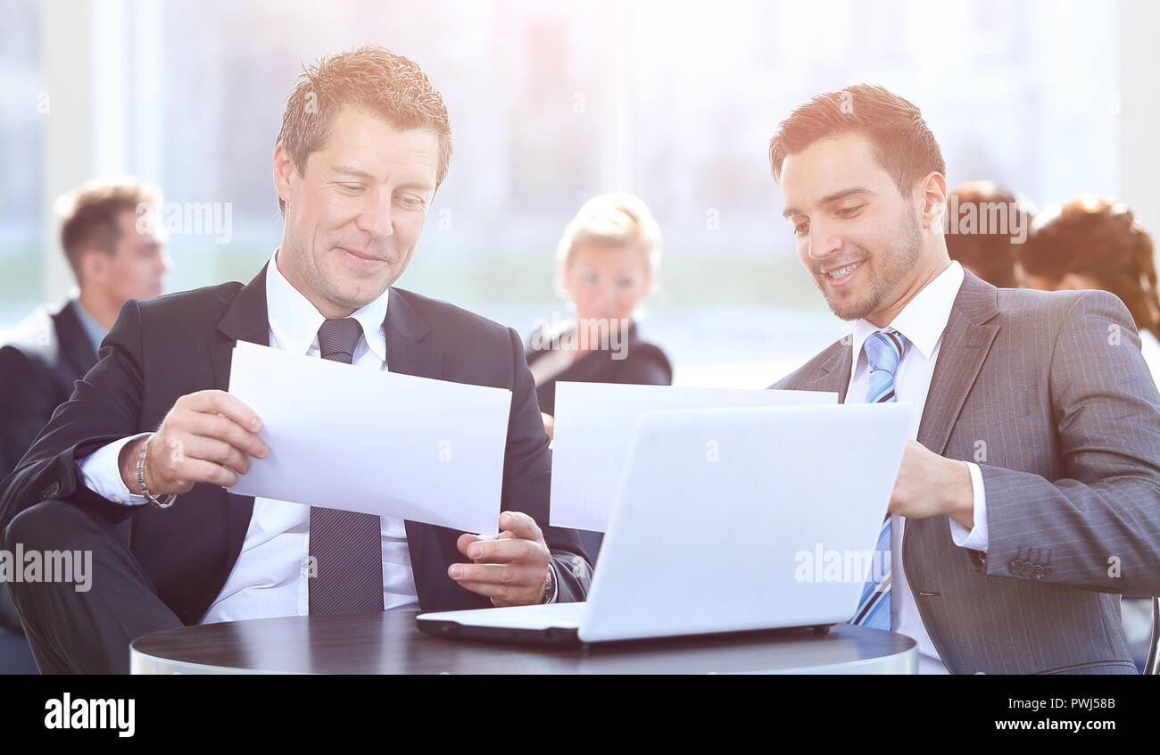 Two men business partners reading hi-res stock photography and images ...