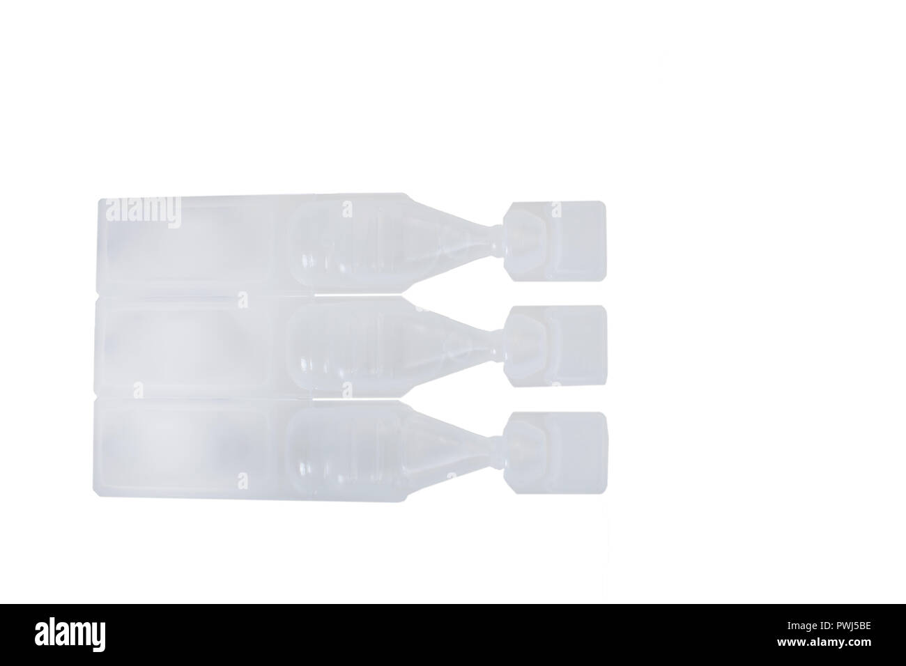 Artificial tears and eye drop capsules isolated on white background ...