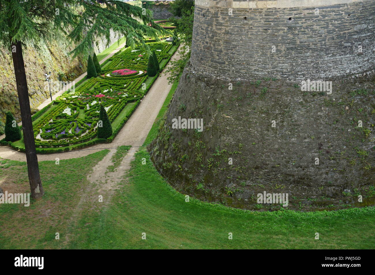 Beautiful colorful tailored gardens at the feet of the old stone ...