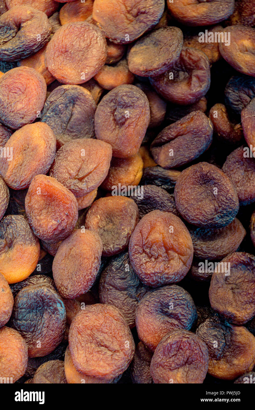 Dried apricot fruit as a whole background texture Stock Photo - Alamy