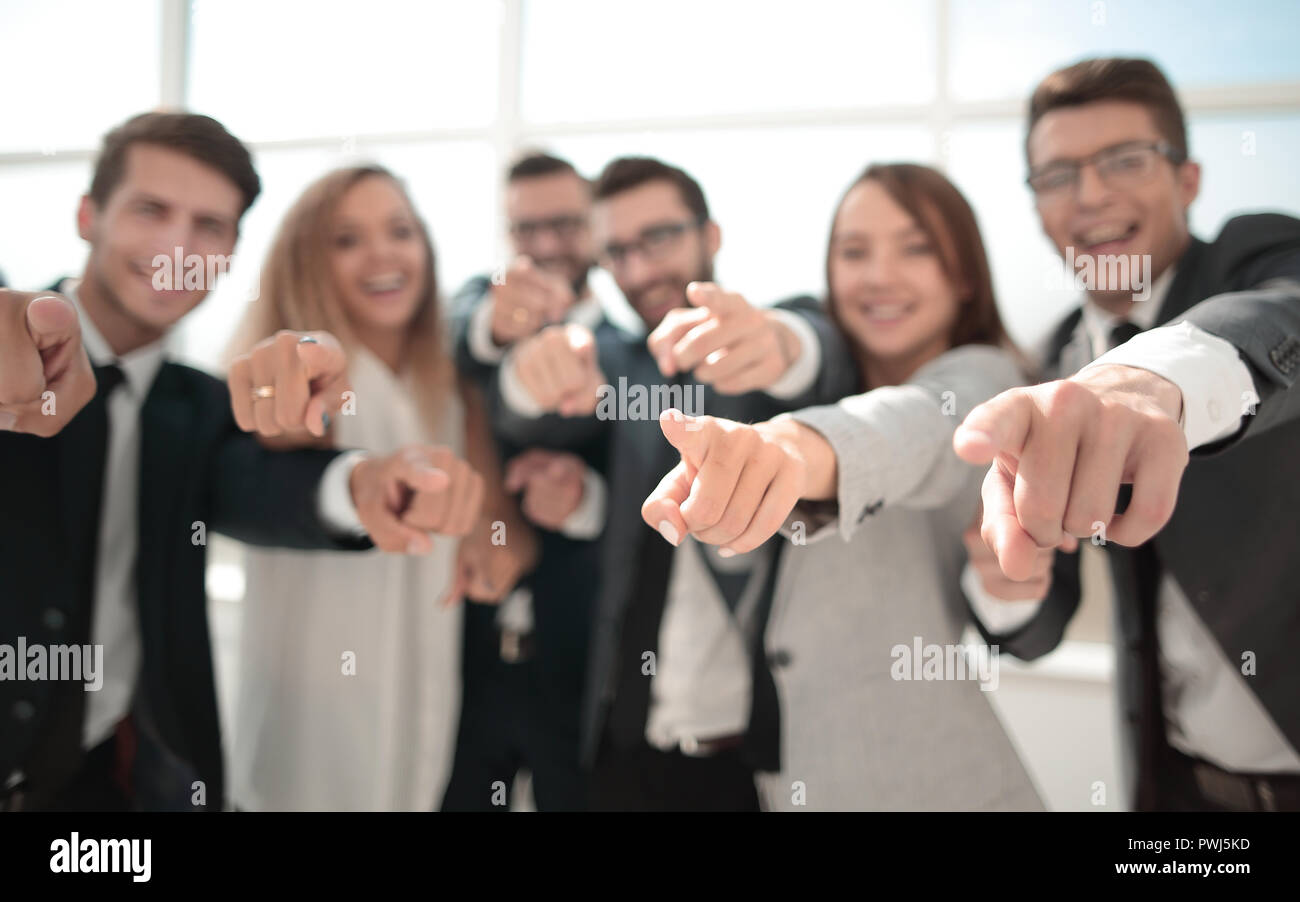 close up. successful business team pointing at you Stock Photo - Alamy