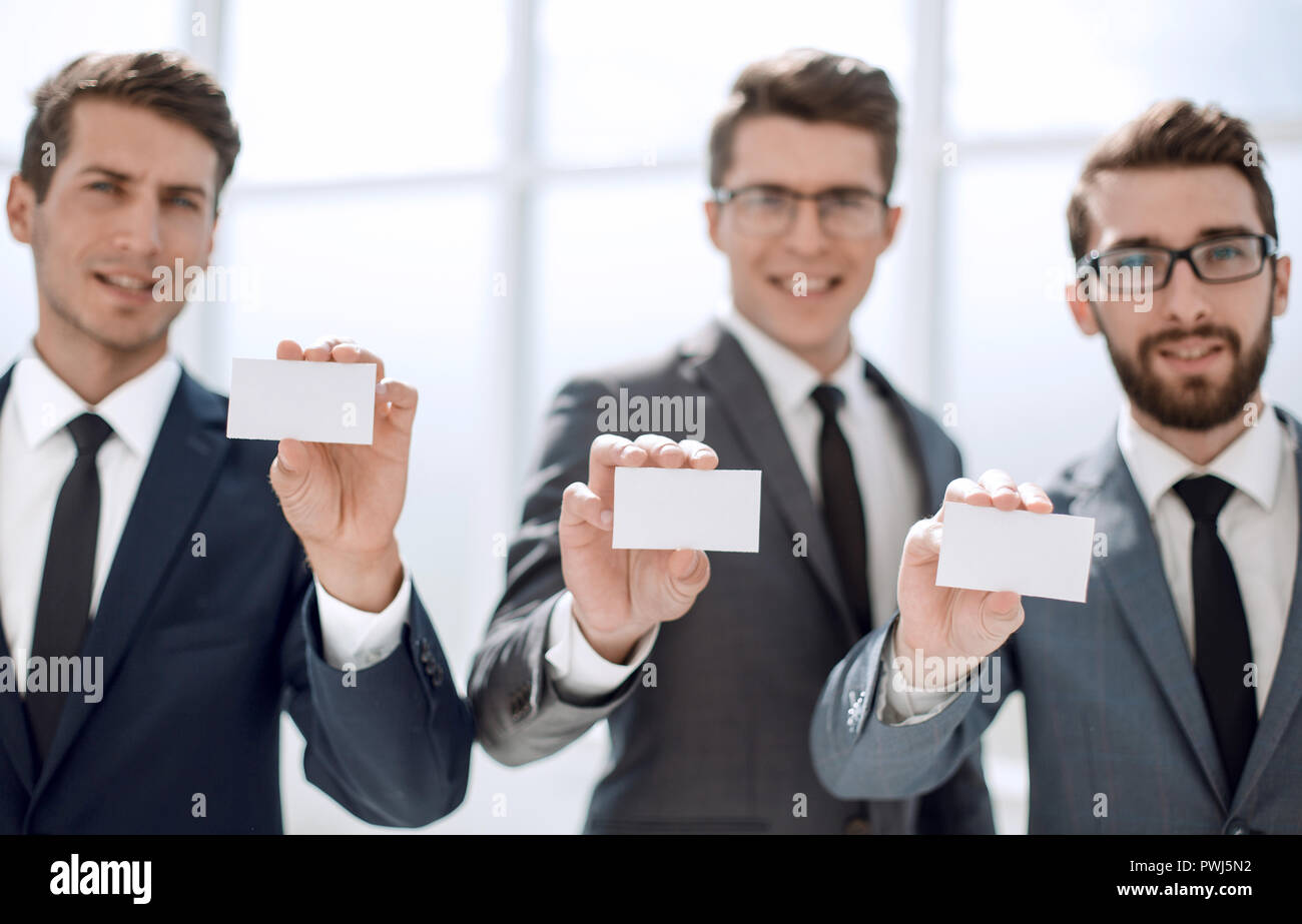 young business people showing their business card Stock Photo - Alamy