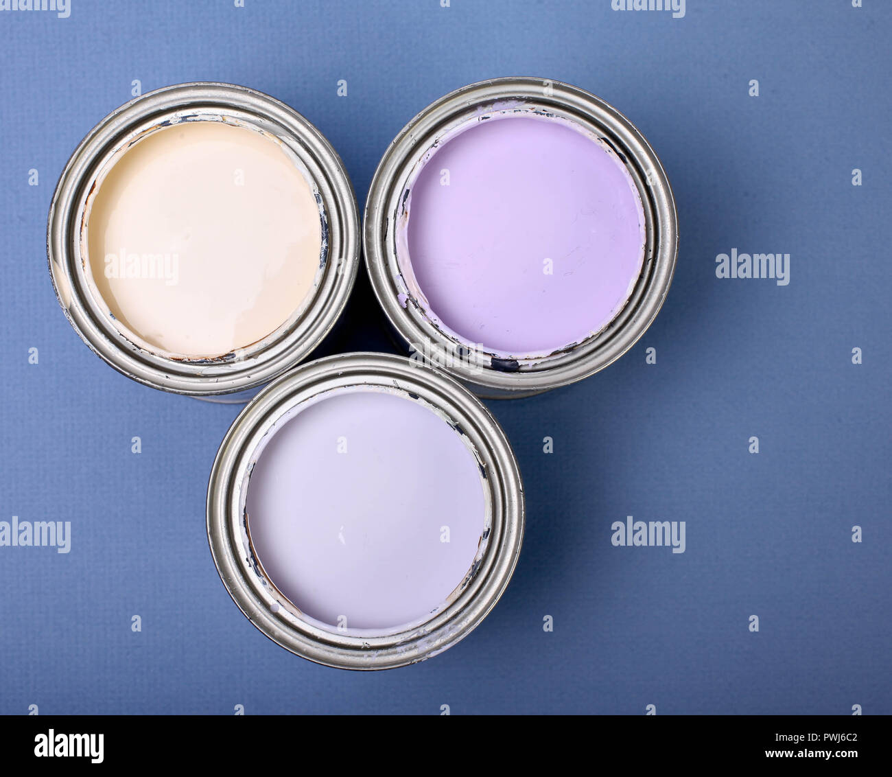 Three different color paint samples on blue background Stock Photo - Alamy