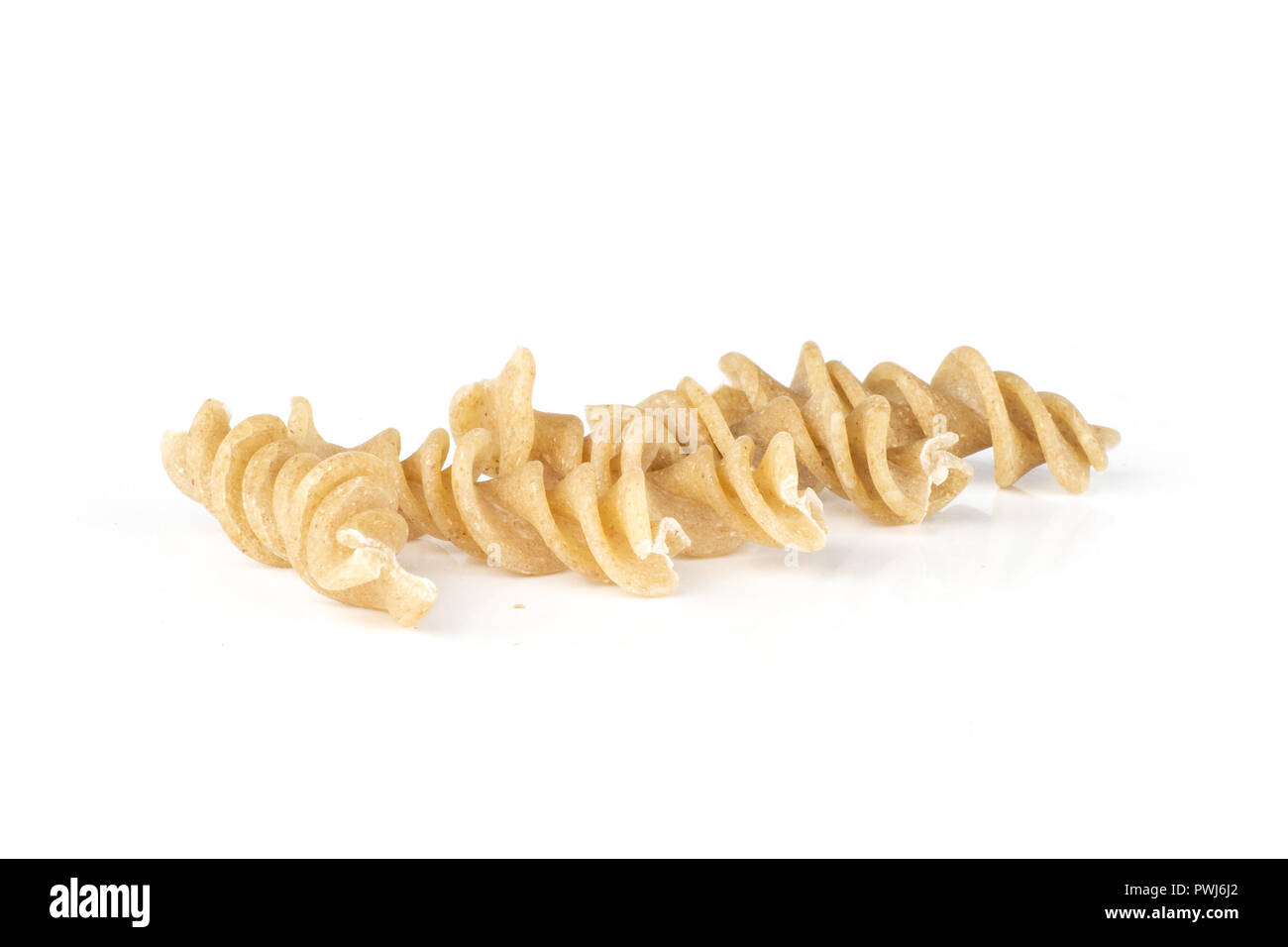 Group of five whole raw pasta fusilli variety isolated on white ...