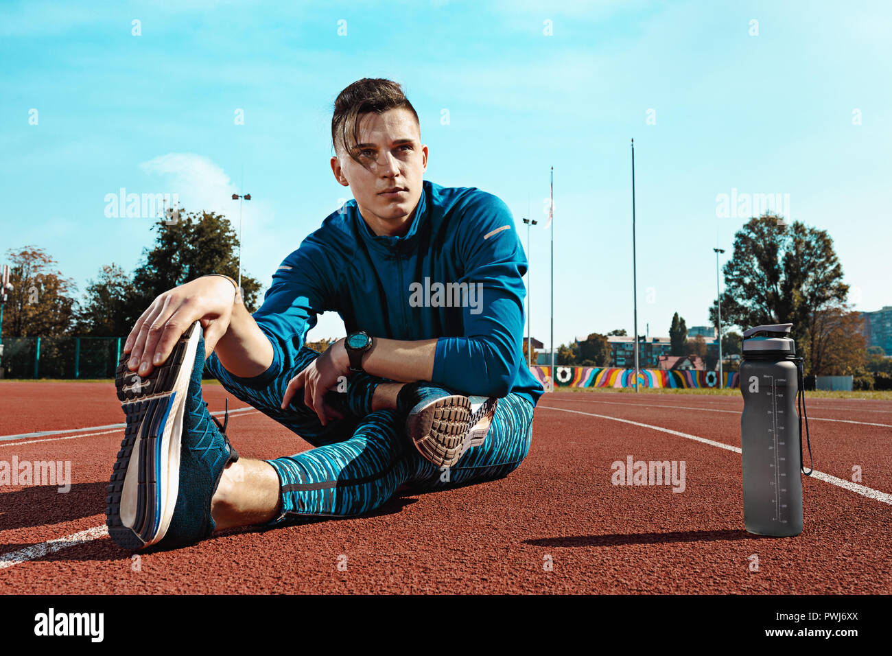 Athlete stretch male stadium hi-res stock photography and images - Alamy