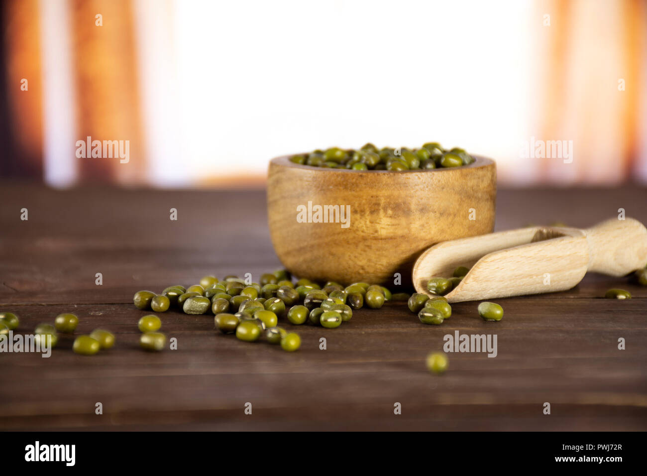 Set of lot of whole dry green mung beans with wooden bowl with silk ...