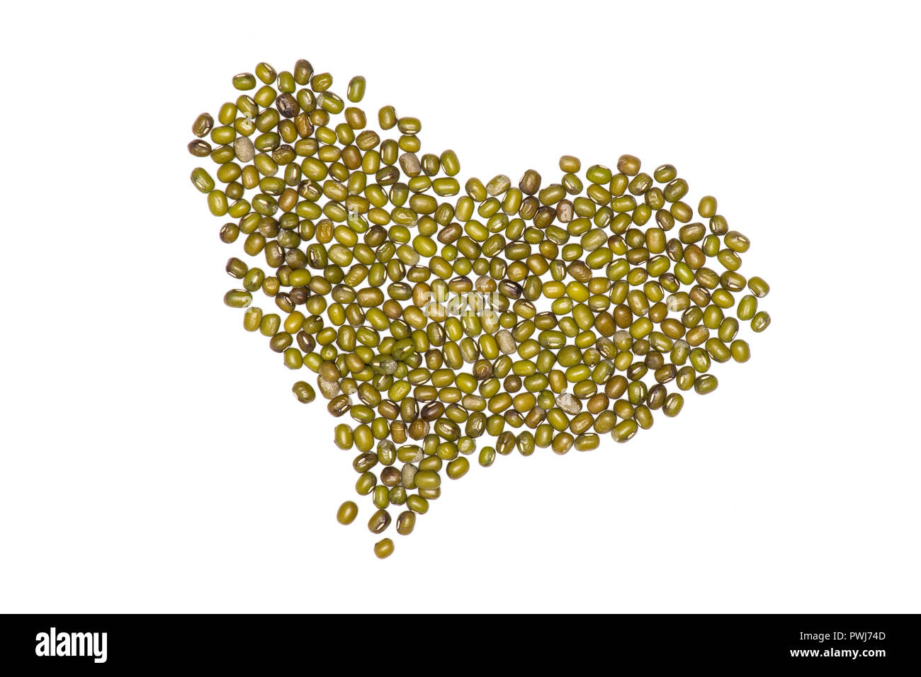 Lot of whole dry green mung beans folded like a heart flatlay isolated ...