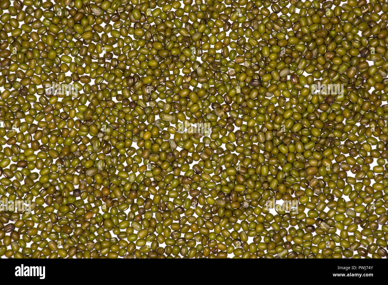 Lot of whole dry green mung beans flatlay isolated Stock Photo - Alamy