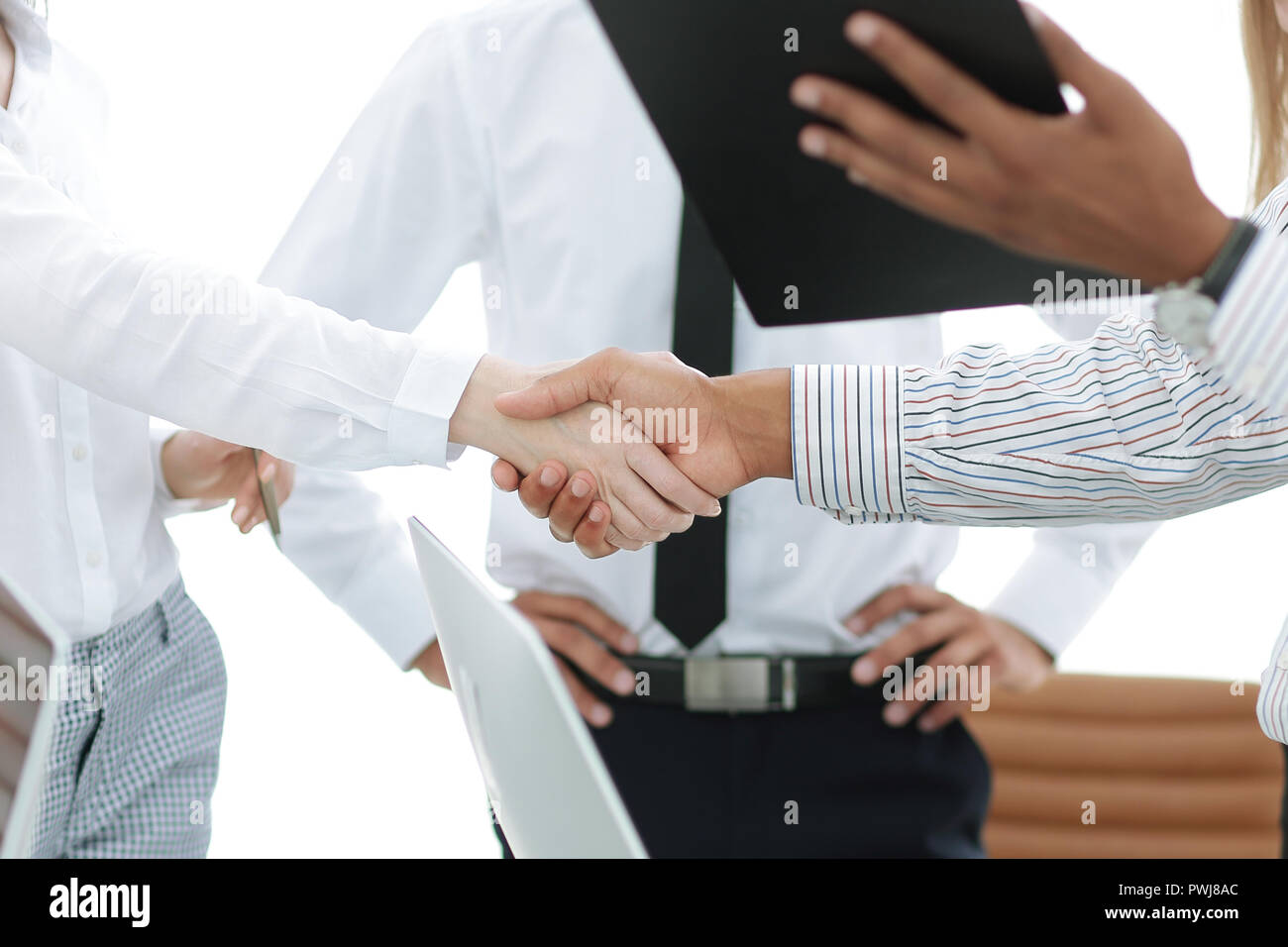 strong handshake between man and woman, both sides viewpoints and ...