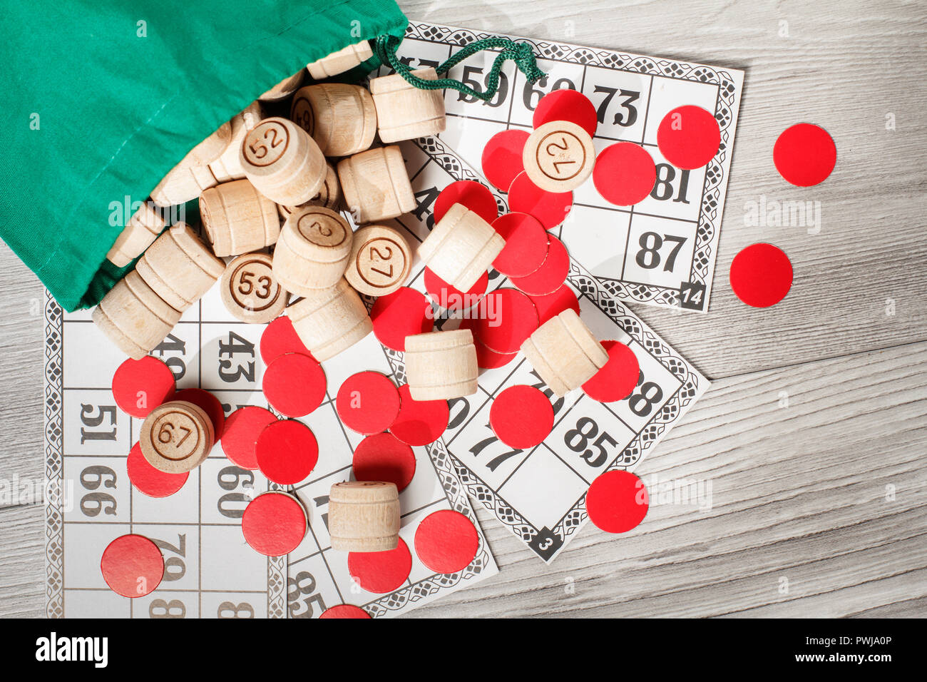 Board game lotto. Wooden lotto barrels with bag, game cards and red ...