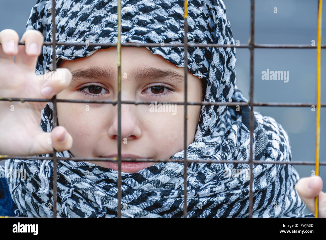 crying refugee girl from the east in a headscarf Stock Photo - Alamy