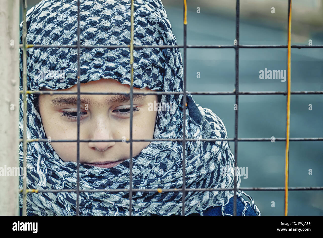 crying refugee girl from the east in a headscarf Stock Photo - Alamy