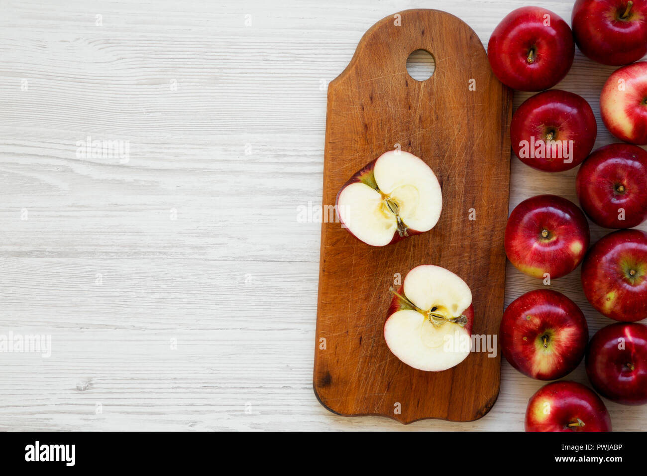 Raw red apples on white wooden background, overhead view. Flat lay ...