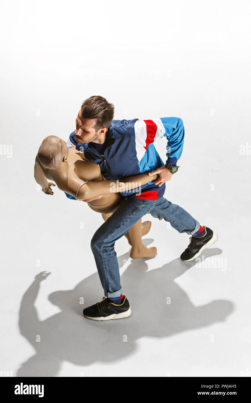 Fashion woman body. The man hugging mannequin at studio, perfect woman ...