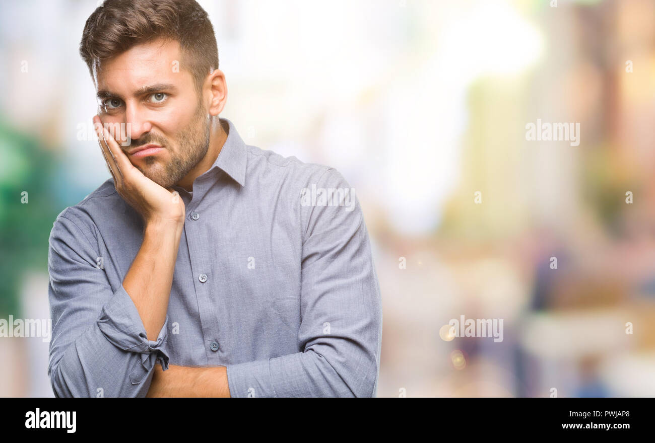 Young handsome man over isolated background thinking looking tired and ...